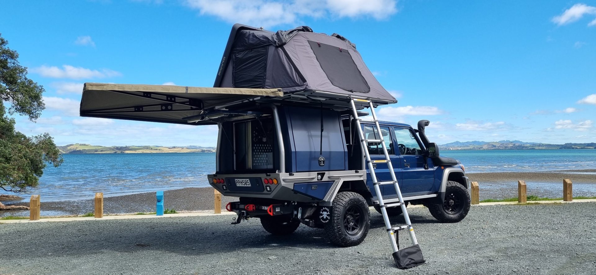 Blue Dbl Cab removable camper setup - Land Pirates